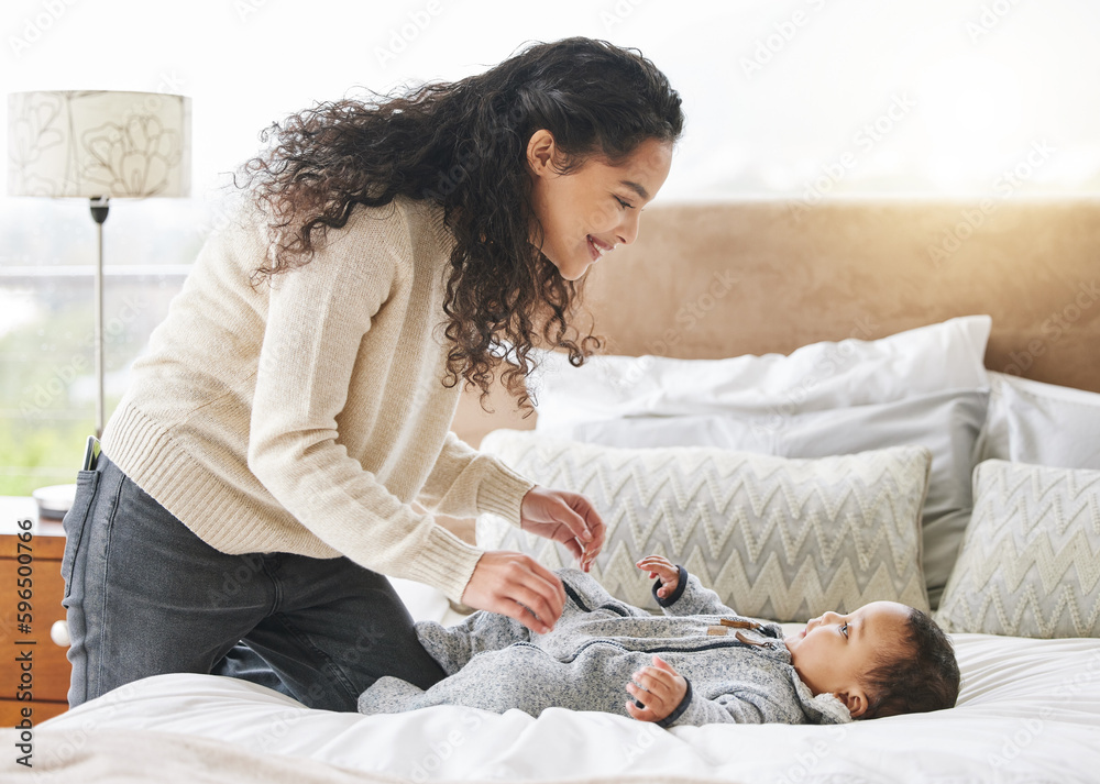 Lets get you into a fresh diaper. Shot of an adorable baby boy and his ...