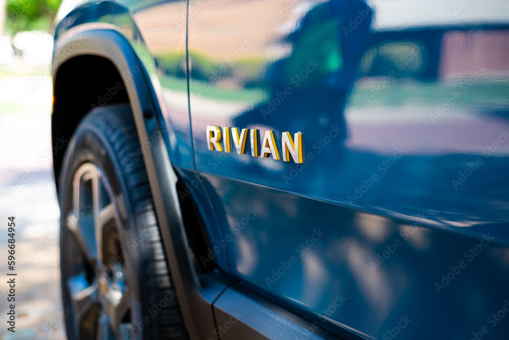Futuristic-looking RIVIAN branding text on driving door of brand-new ...