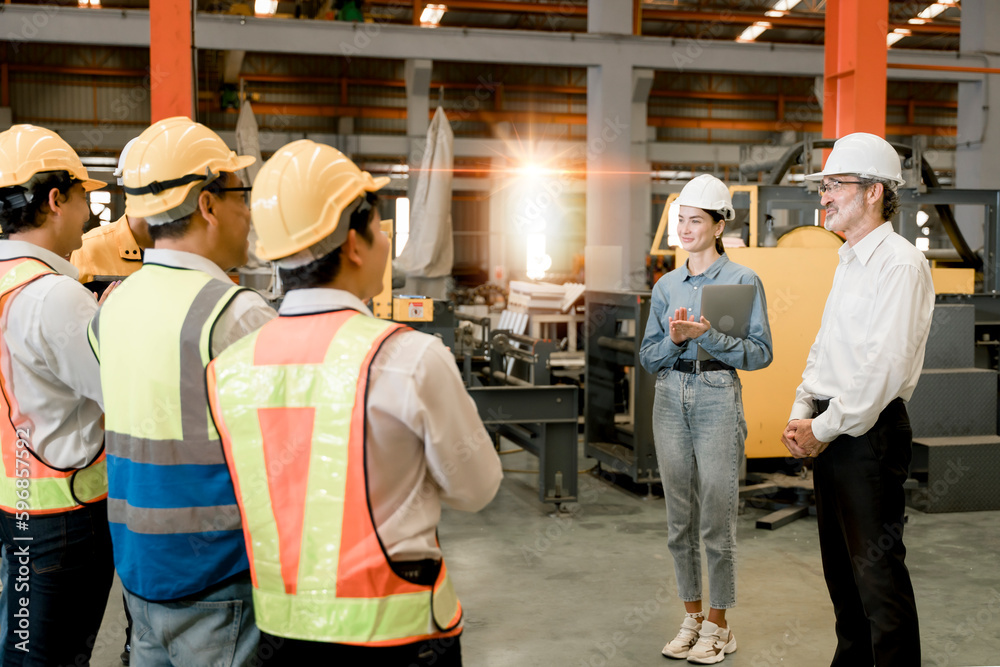 woman worker and engineer under inspection and checking production ...