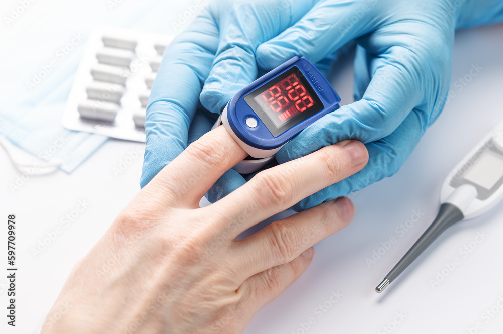 Pulse oximeter measuring oxygen saturation in blood and heart rate ...