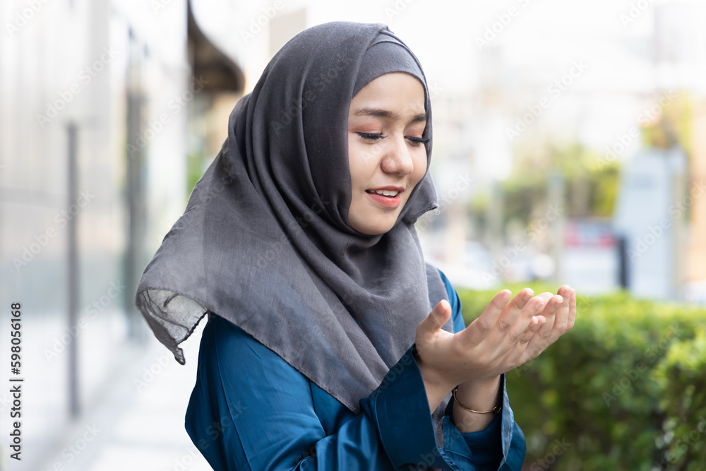 Southeast asian muslim woman in day time prayer, concept of Islamic ...