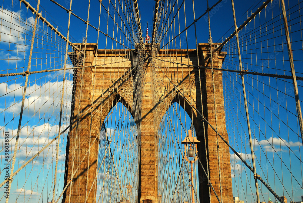 Long cables reach to and from the Gothic stone anchor of the historic ...