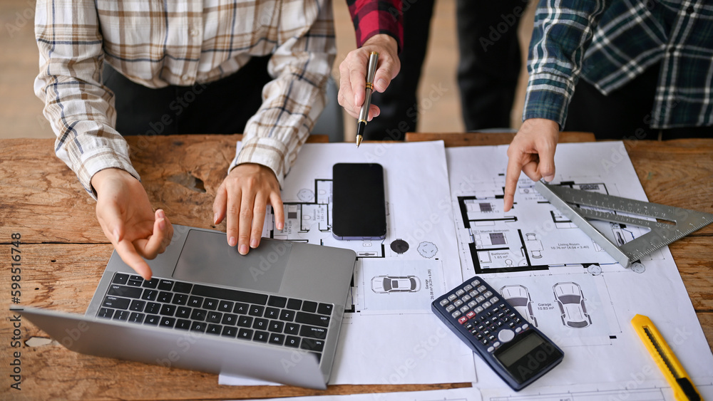 Cropped image of smart engineers are measuring and checking building ...