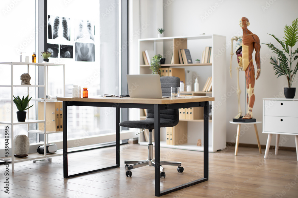Comfortable workstation for medical specialist with office desk, laptop ...