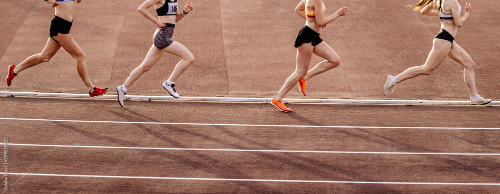 four female athlete runners middle-distance running race, summer ...