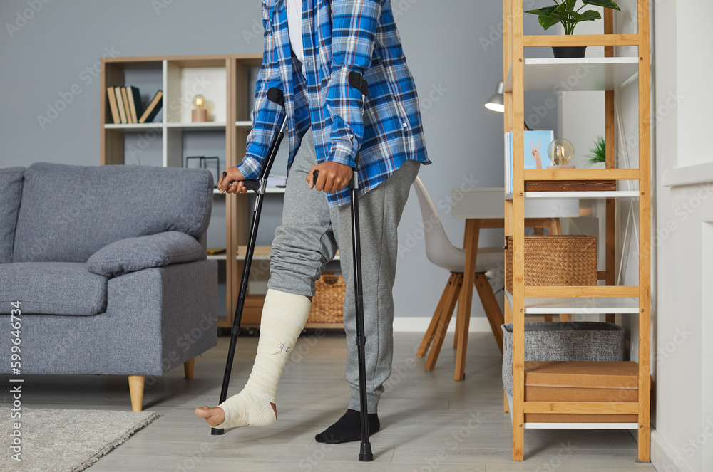 Cropped photo of a handicapped african american man with broken leg ...