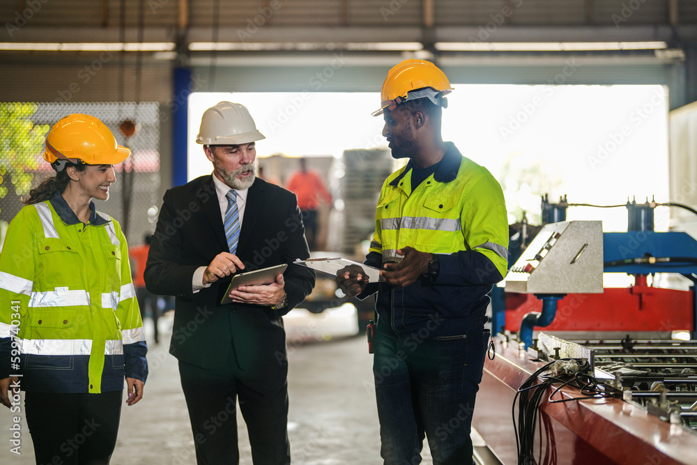Senior boss manager talking staff engineer assistant woman and African ...