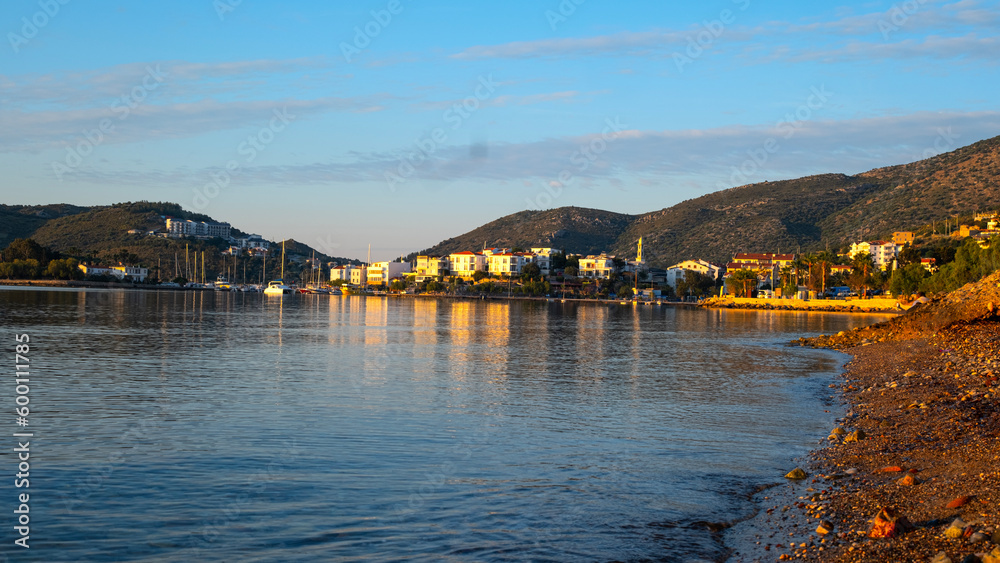 Calm sea and reflections at sunrise in Datça, the famous holiday resort ...