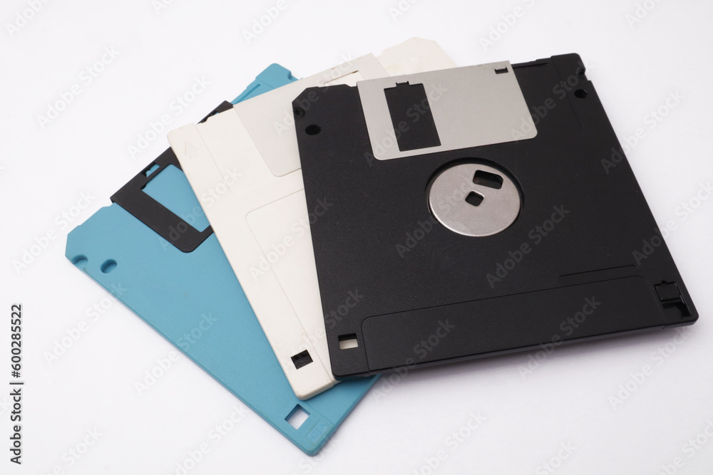 Retro vintage floppy disk diskettes on white, old time computer storage ...
