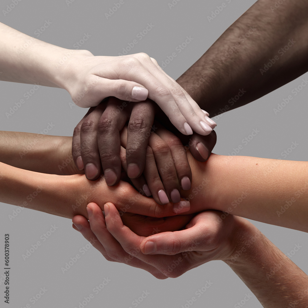 Support and care. Human hands of different race, skin color holding ...