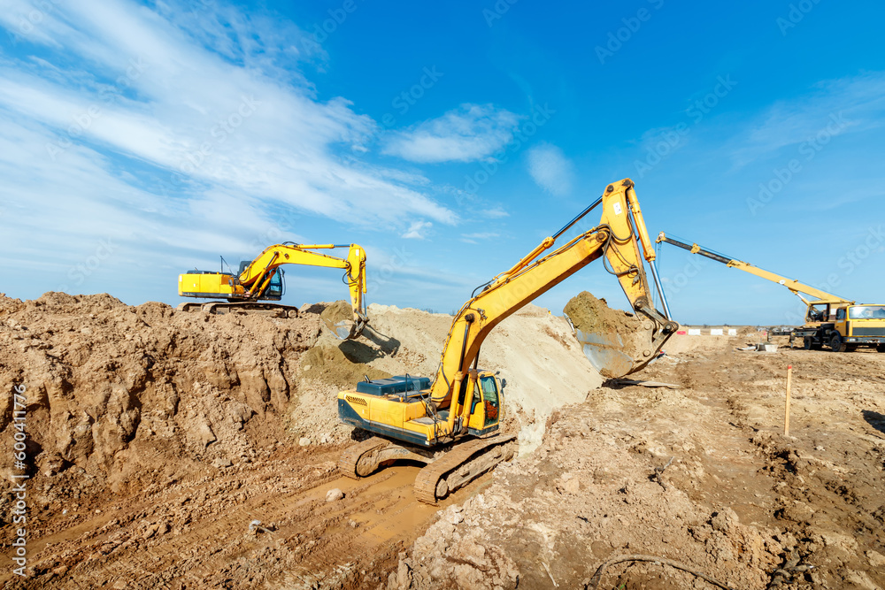 Two Excavator are digging soil in the construction site on sky ...