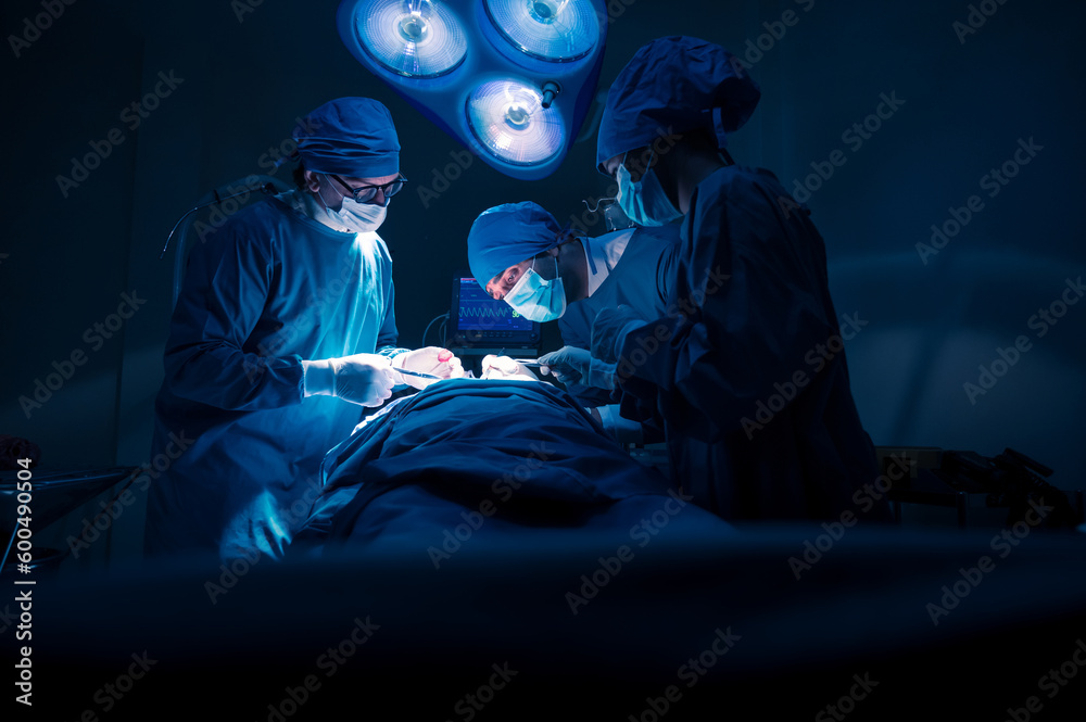 Group of concentrated surgical doctor team doing surgery patients in ...