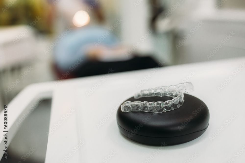 Invisible orthodontics cosmetic brackets on gradient background, tooth ...