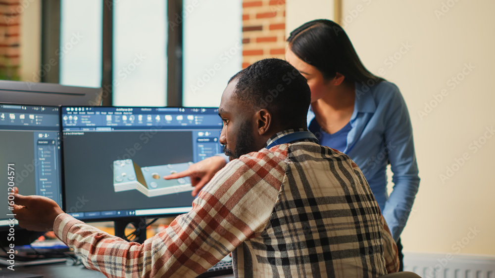 Photo Stock Artistic digital technicians talking about machine development, working together on ...