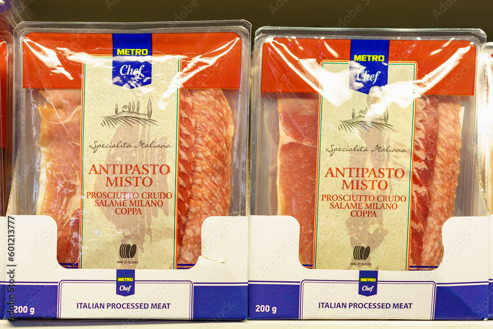 Packages with cold cuts in the refrigerator of a supermarket. March 9 ...