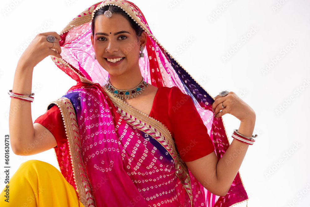 Portrait of Rajasthani woman sitting against white background Stock ...