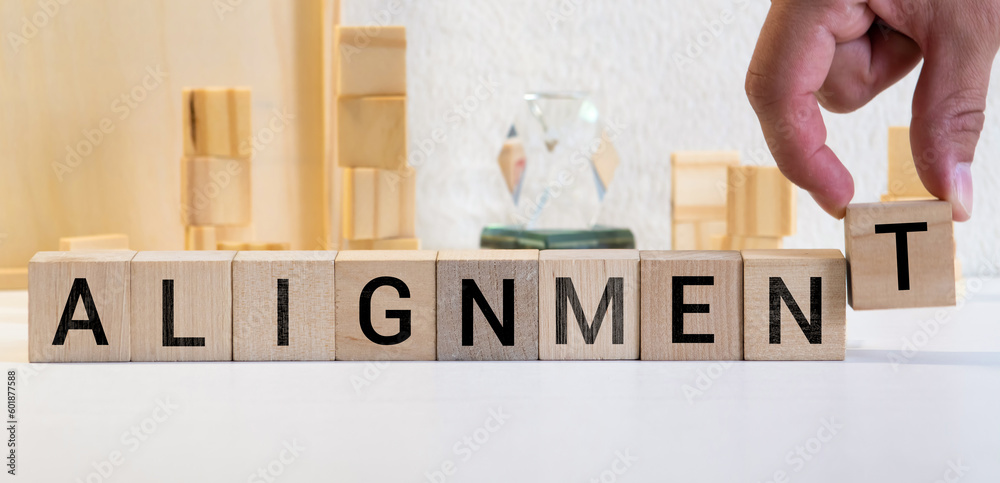 Alignment. Cubes form the word Alignment. Broad concept from business ...