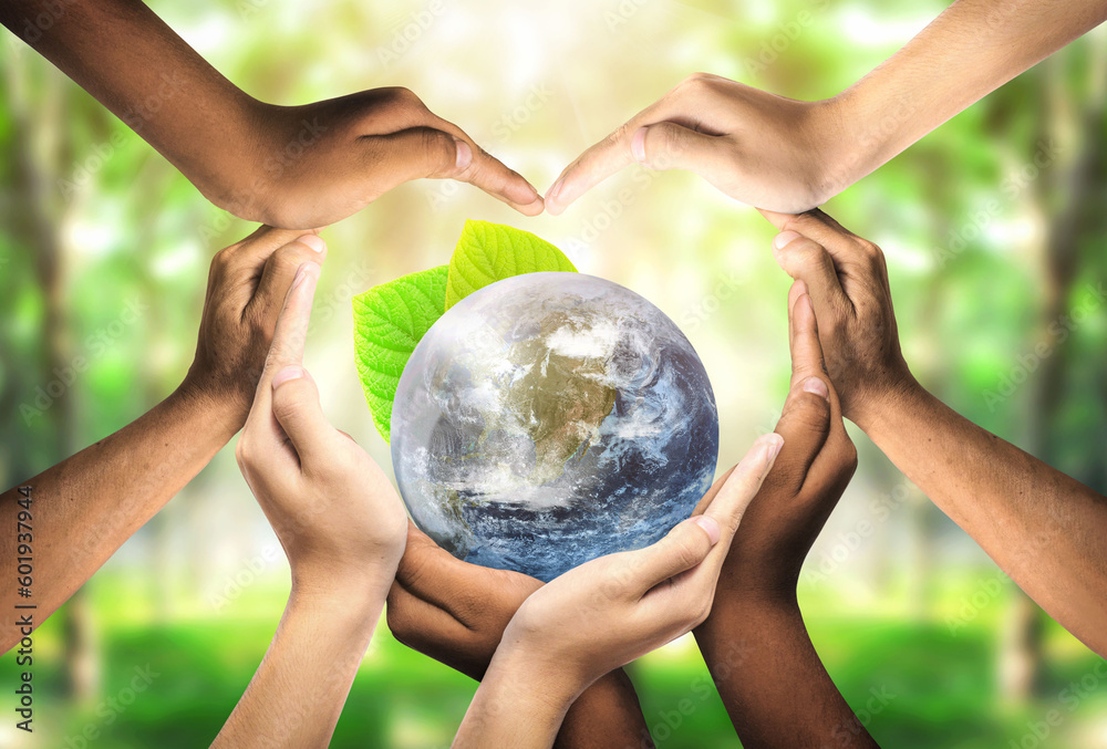 Fotografie Conceptual symbol of multiracial human hands surrounding the ...