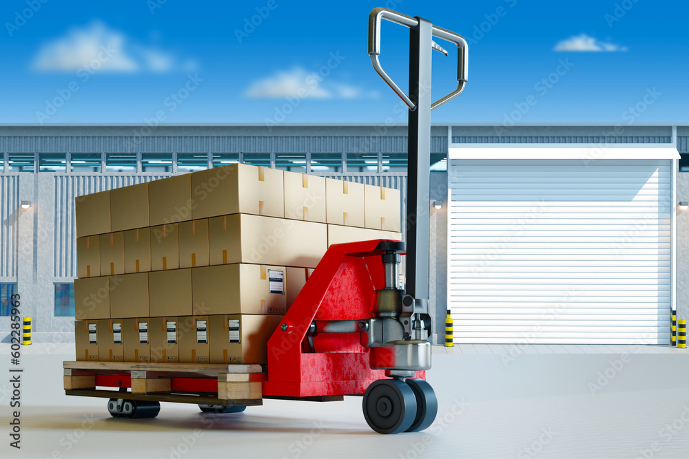 Pallet jack with parcels. Red hydraulic jack. Boxes near warehouse ...