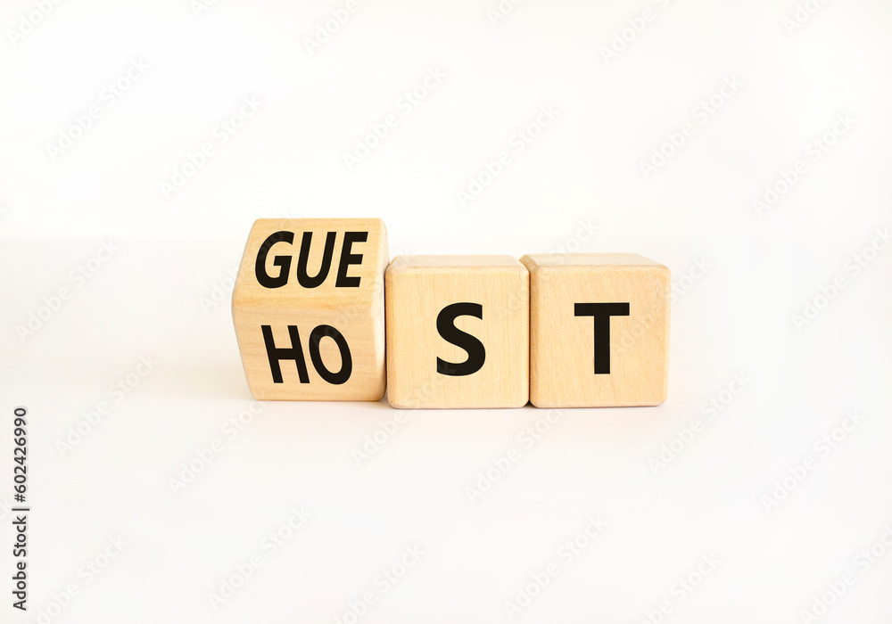 Guest and host symbol. Businessman turns wooden cubes and changes the ...