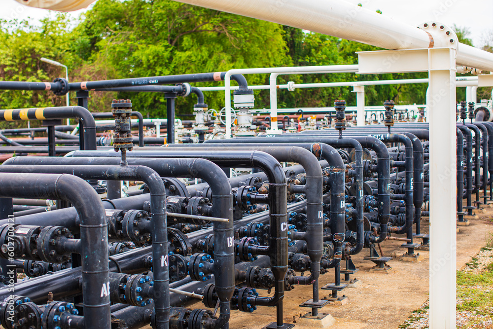 Steel long pipes and pipe elbow in station oil factory during refinery ...