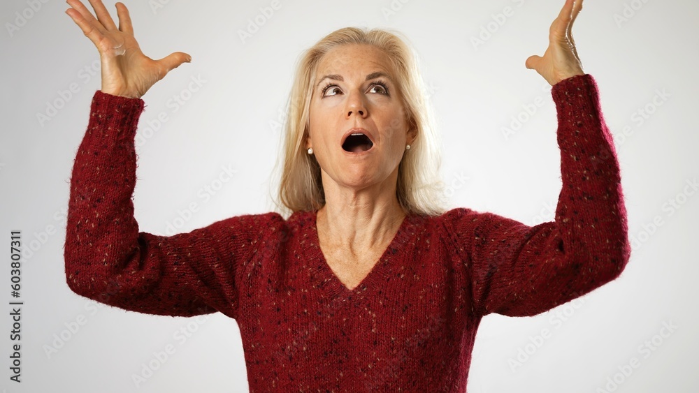 Happy smiling mature older woman gives mind blown gesture showing ...