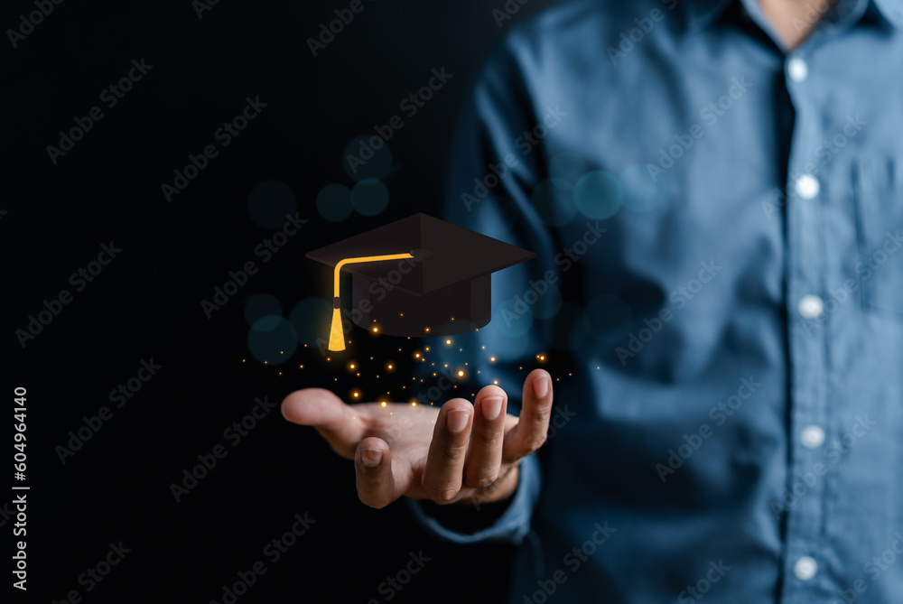 Hand holding education cap, leading to success goal. Taking strategic ...