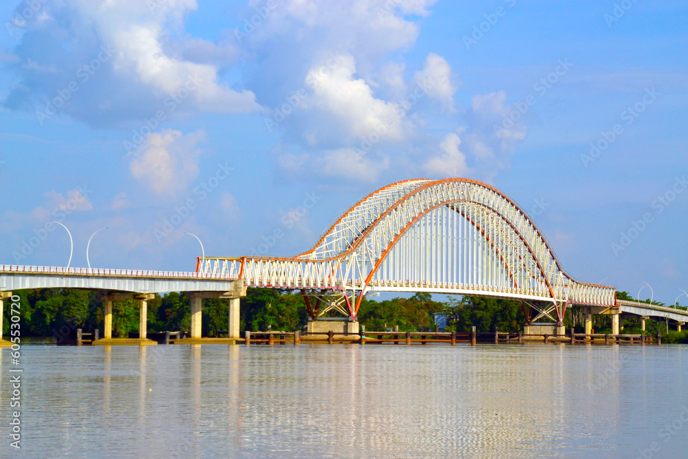 The Tayan Bridge arch is a bridge that crosses the Kapuas River and is ...