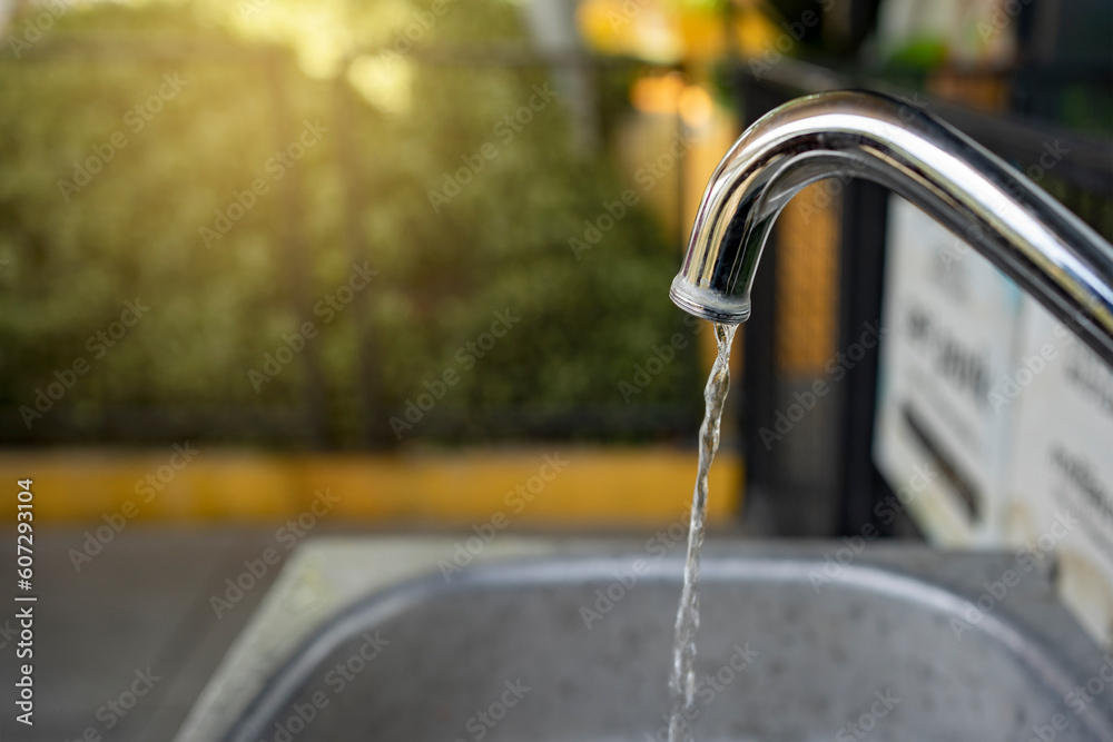 Water running from a tap. water drop dripping from the tap and water ...