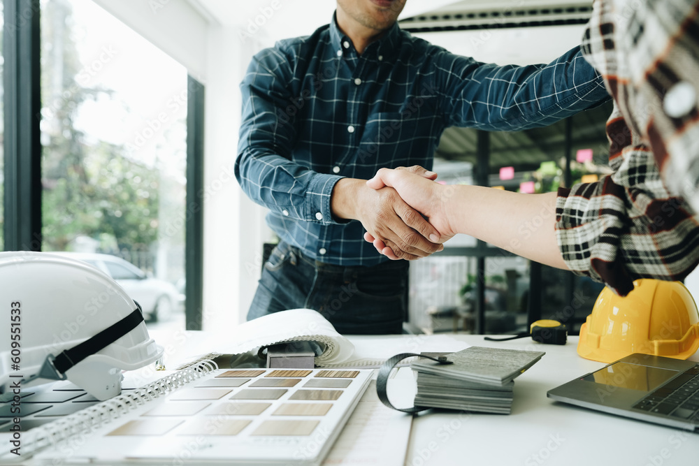 Engineers, designers and interior designers are handshake shack hands ...