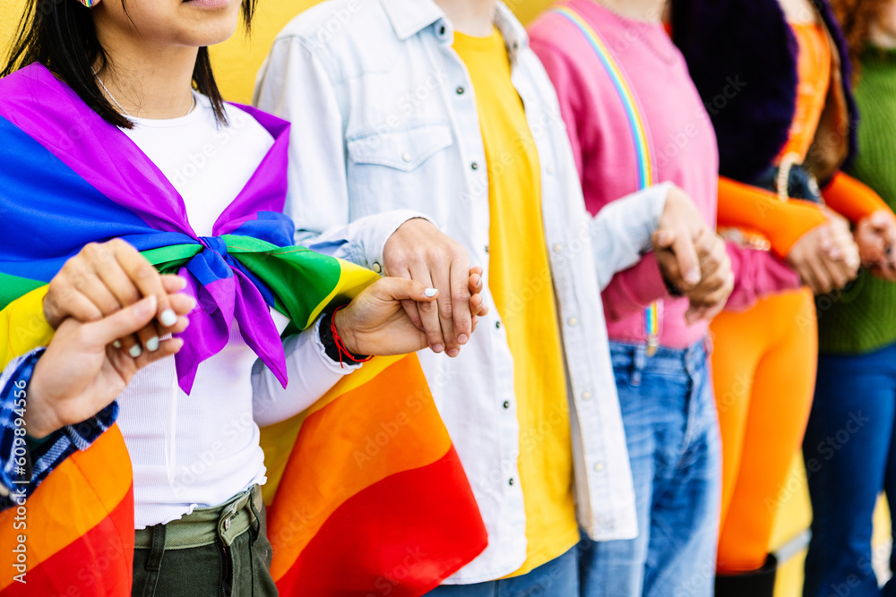 Young group of LGBT community people holding hands outdoors showing ...