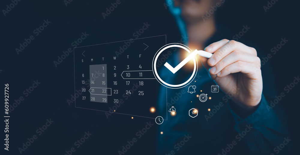 person typing on a touch screen schedule plan calendar. project gantt ...