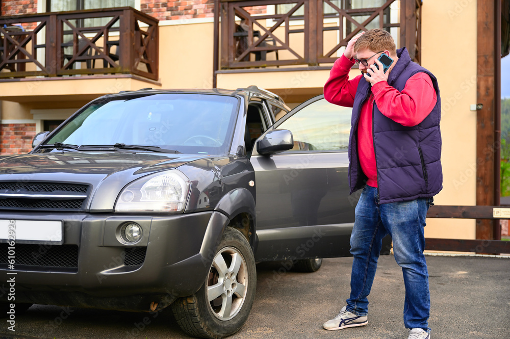 A man, after stepping out of his car, noticed damage to the wing of his ...