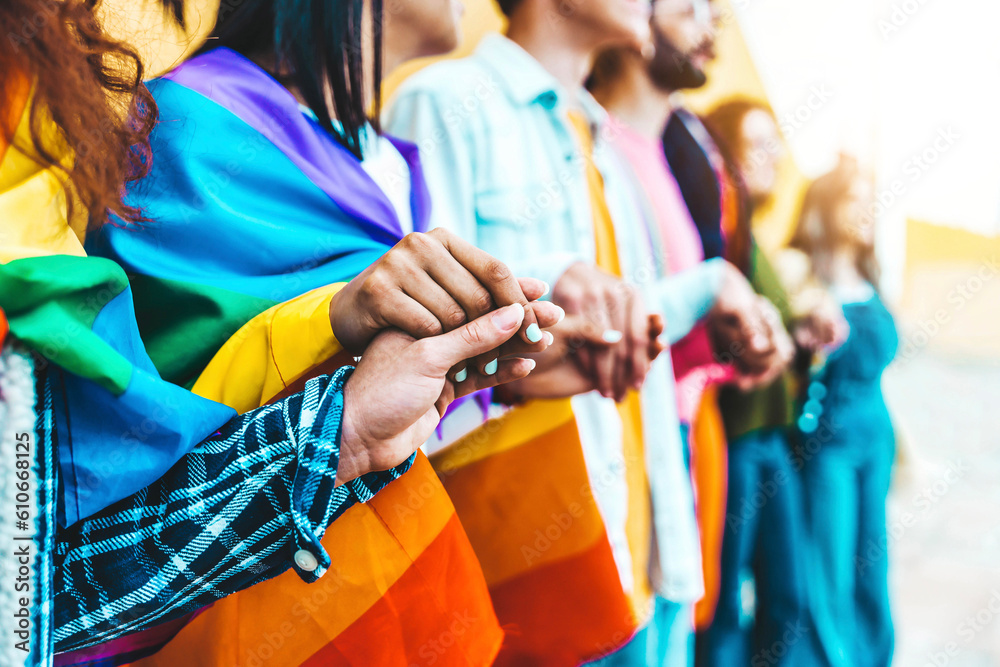 Group of lgbt people holding hands outside - Diverse happy friends ...