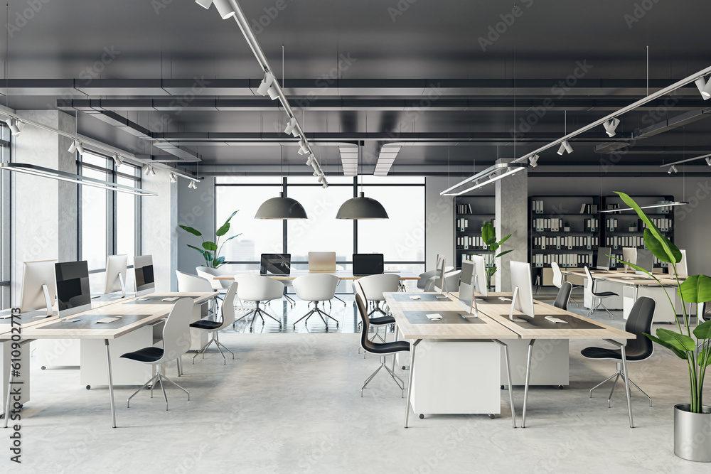 Front view of an open office interior with desks, computers, a concrete ...