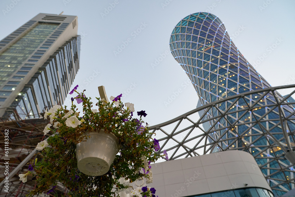 DOHA, QATAR - CIRCA MARCH, 2023: flowers with Tornado Tower in the ...