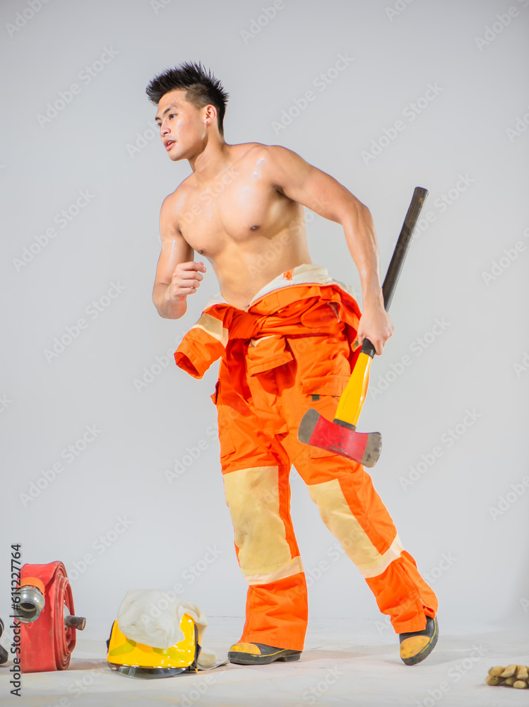 Photo Stock Professional firefighters strong and muscular physique is ...
