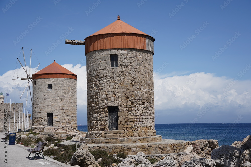 Medieval windmills of Rhodes town. Mandraki Harbour in the Dodecanese ...