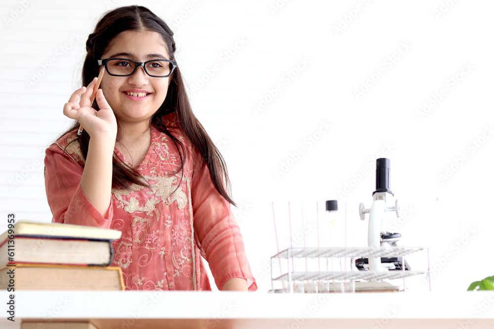 Cute Indian school girl in India traditional dress costume doing ...