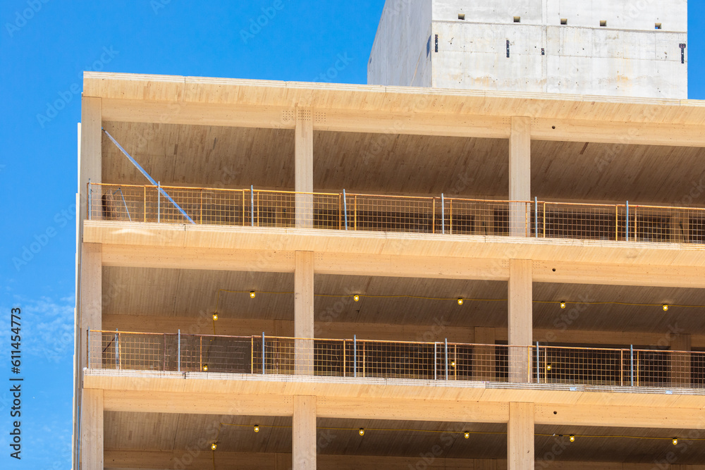 The concrete elevator core on top of the center of an engineered timber ...