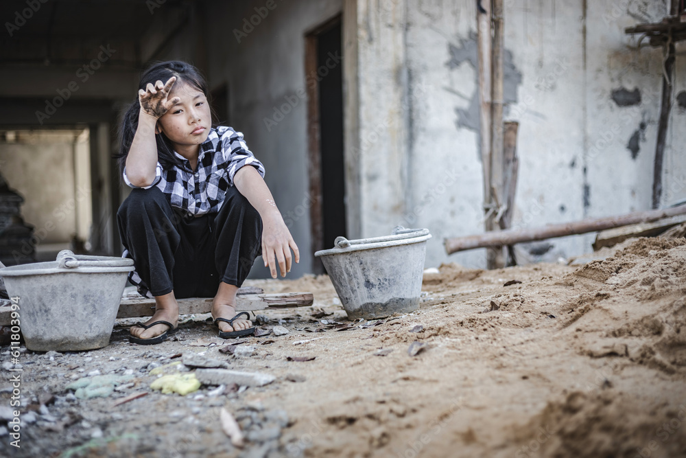 Sad child labor girl relaxing from construction work. World Day Against ...