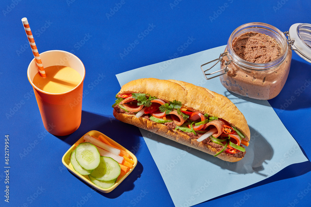 Against the blue background, a delicious bread decorated with paper cup ...