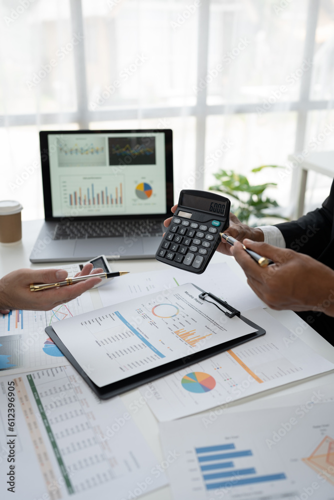 team work process Business team use calculator to calculate figures ...