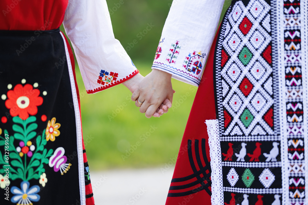 Girls in traditional bulgarian ethnic costumes with folklore embroidery ...