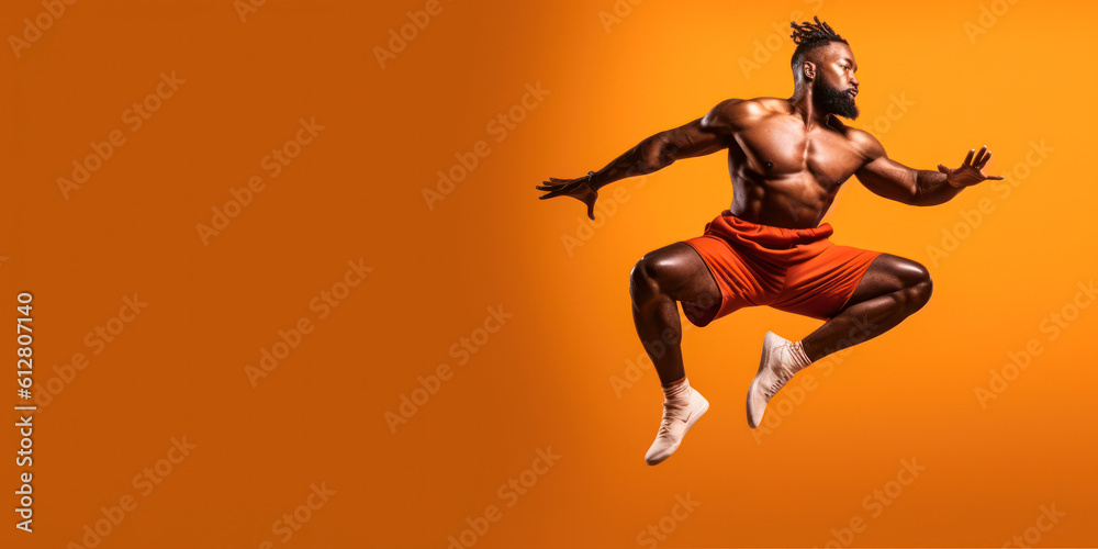 Athletic man jumping in dynamic pose, floating in midair, wearing ...