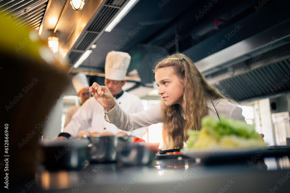 cooking under the guidance of seasoned chefs at a culinary school's ...
