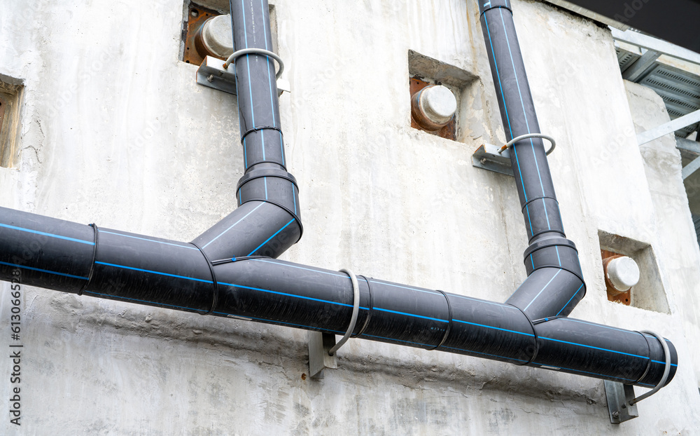 Polyethylene pipes drain water from sky train tracks. HDPE pipeline ...