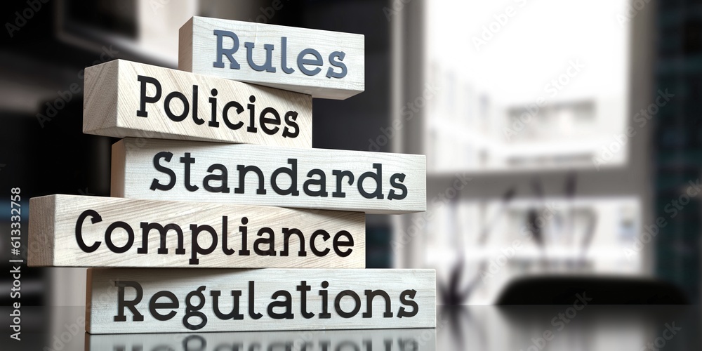 Rules, policies, standards, compliance, regulations - words on wooden ...
