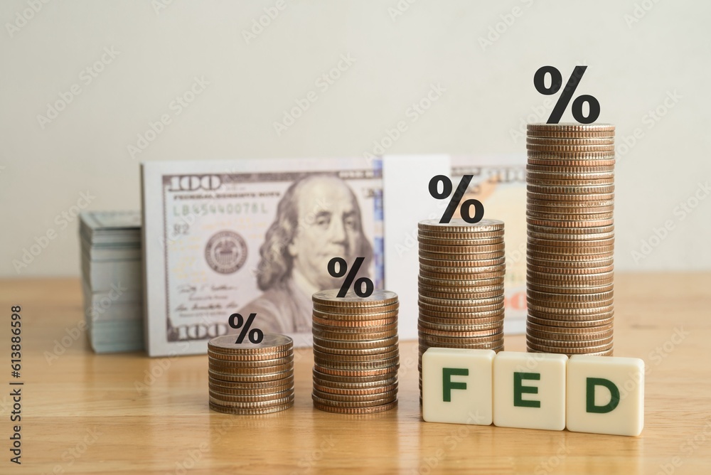 Interest rates on stack coins as graph chart growing up trend with FED ...