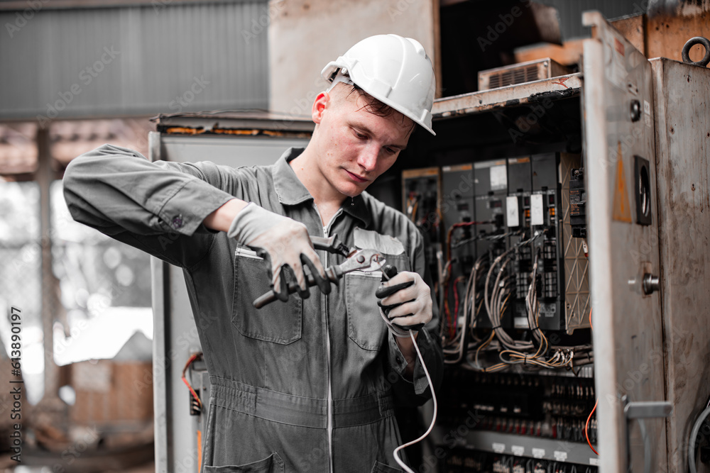 Electrical technician tests wiring, polarity, grounding, voltages and ...